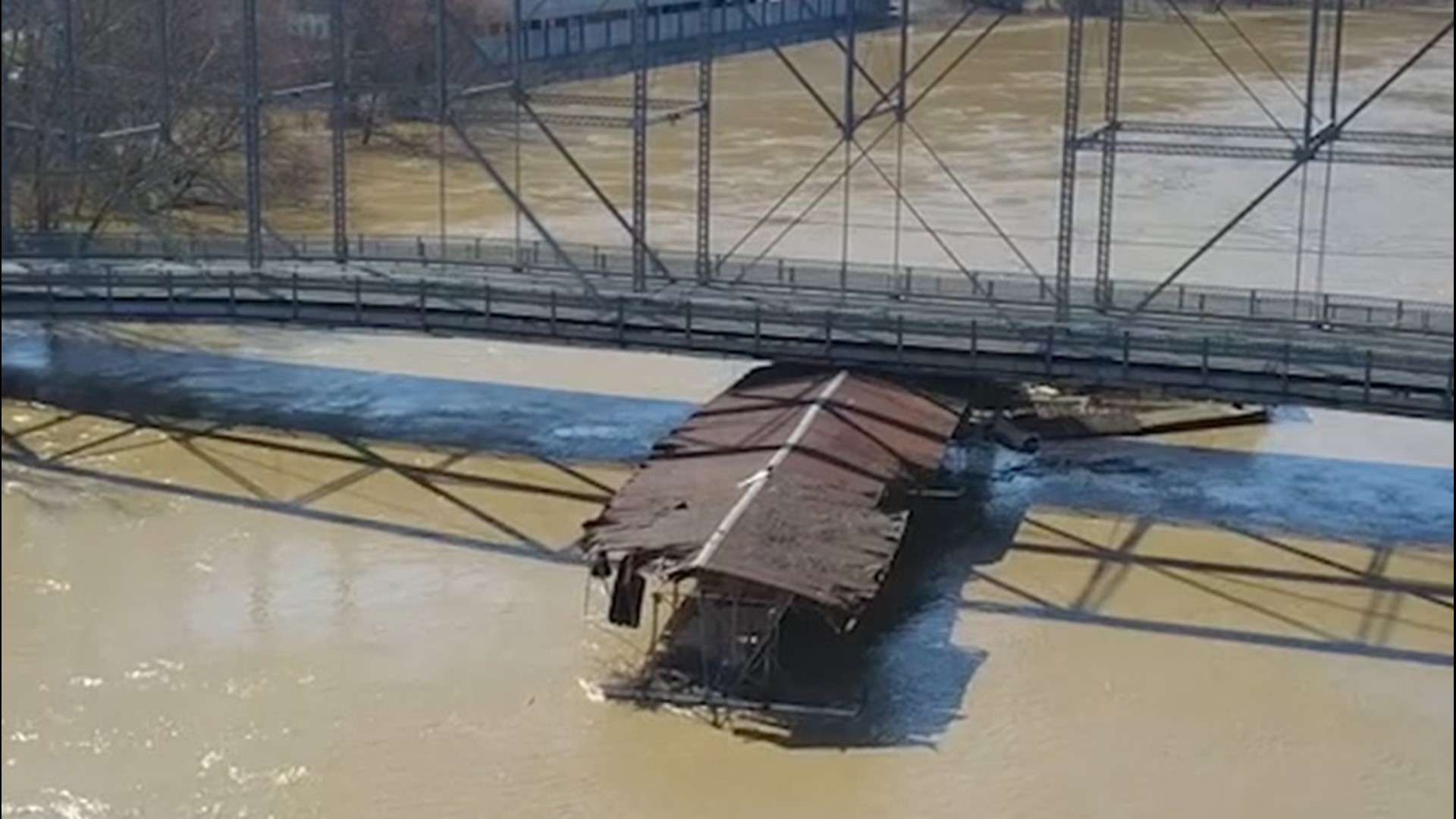 Flooding causes loose marina to slam into bridge | whas11.com