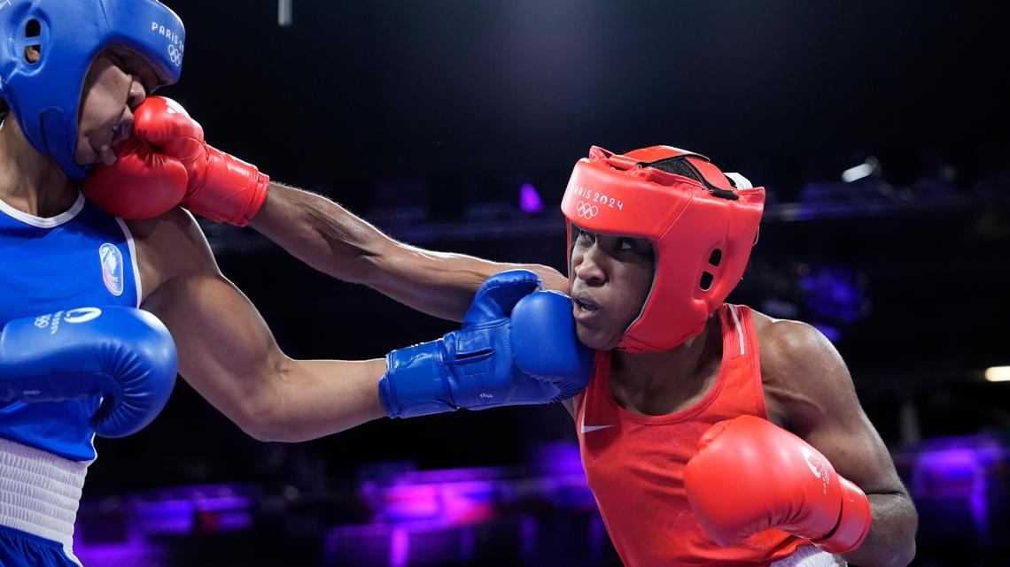 Boxer Cindy Ngamba becomes 1st on Refugee team to clinch medal | whas11.com