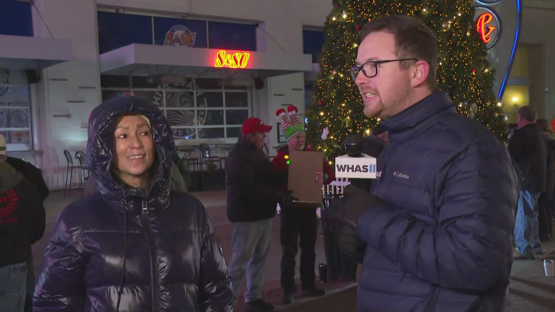 Volunteers form human assembly line at Louisville's Fourth Street Live ...