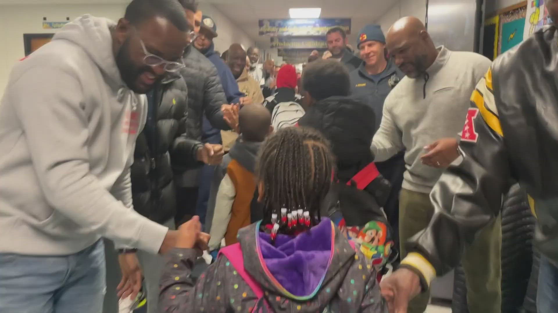 'Flash Dads' surprise students at Louisville elementary school | whas11.com