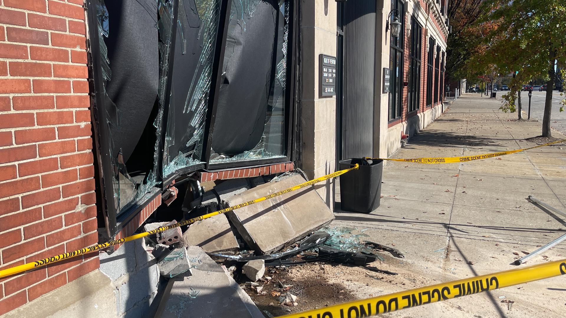 Two injured after car crashes into downtown Louisville building ...
